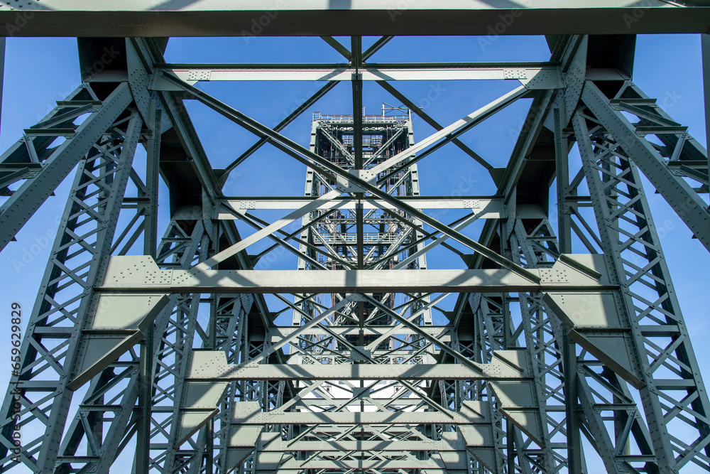 Low angle view of the steel structure of vertical-lift rail bridge De ...