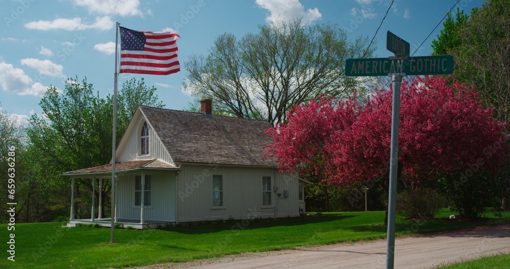 The iconic “American Gothic House,” made famous by artist Grant Wood ...