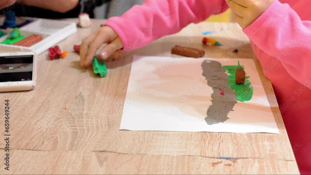 mom and daughter spend time together - molding from plasticine ...