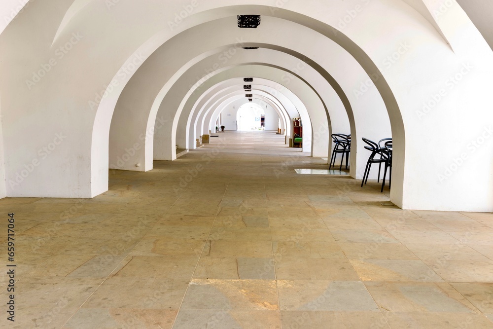 The market square is surrounded by architectural structures of ...