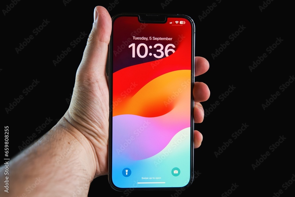 Poland Europe 11.09.2023. Man hand holding iPhone 13 pro max with IOS ...