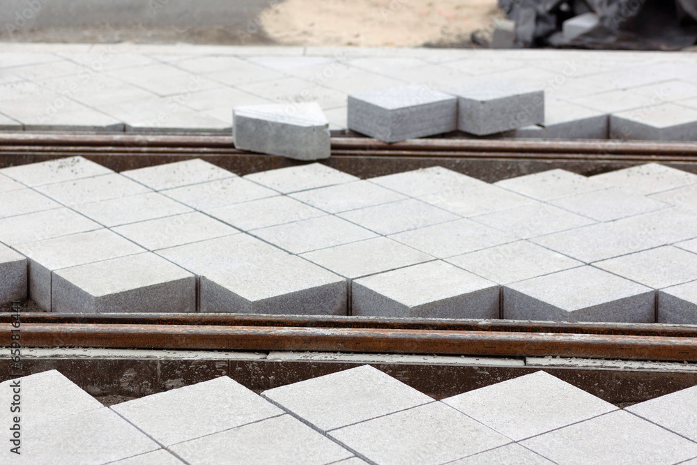 Tram Track Laying in Paving Stones Road. Installing Tram Rails on ...