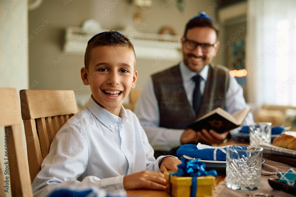 Happy Jewish kid enjoys with his father during traditional festival of ...