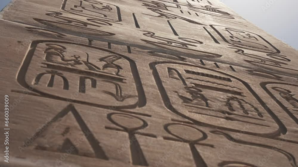 Close up of replica of the tall Egyptian obelisk with hieroglyphs with ...