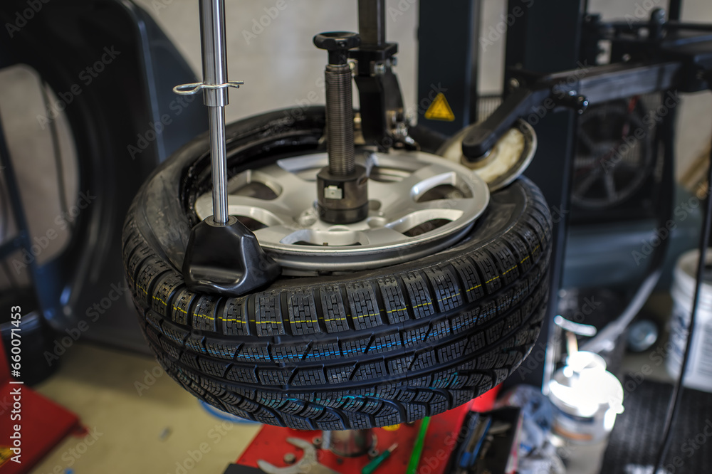 Tyre removed from the rim by tyre changer for cars and motorcycles in ...