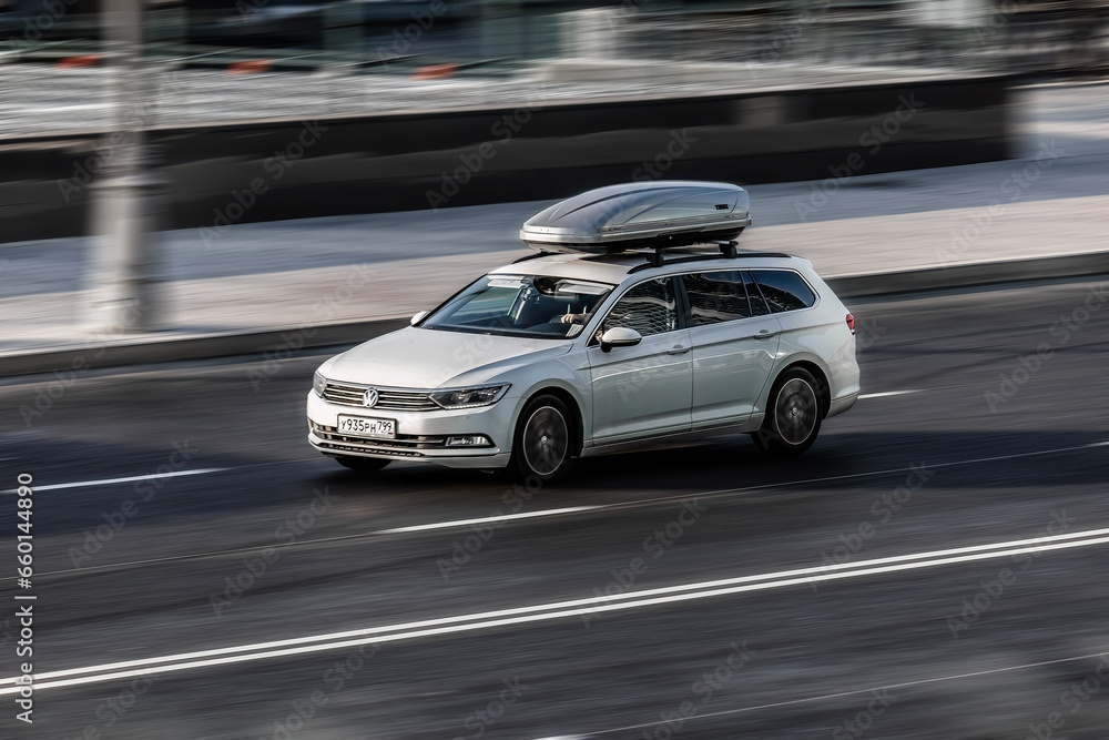 VW estate driving fast motion on the highway, front side view. White ...