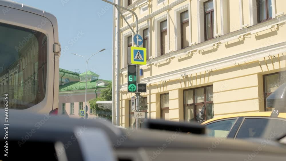 traffic light red and switches to green. daytime shot in city traffic ...