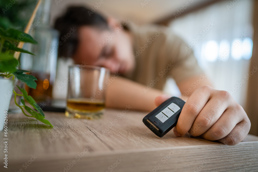 one man sit at home with bottle of liquor drink whiskey drunk alcoholic ...