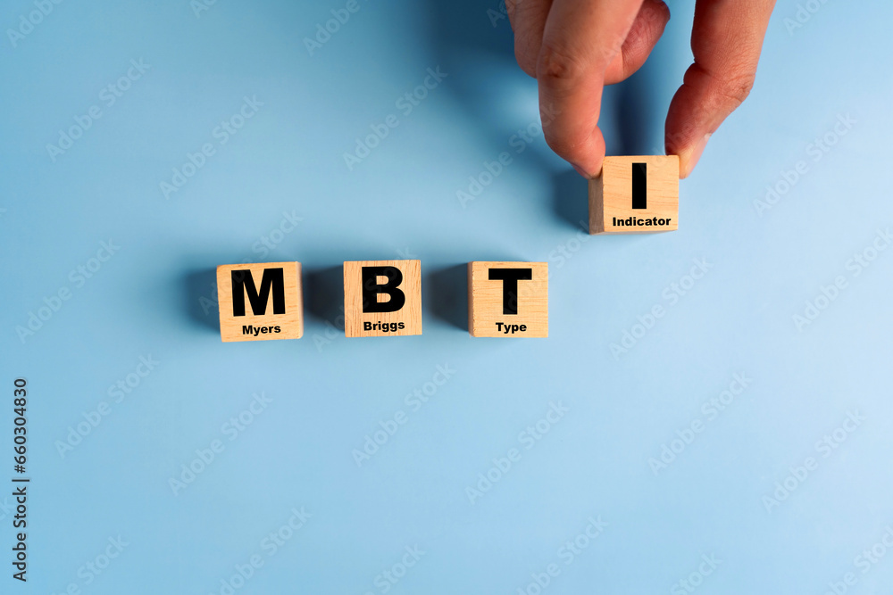 Wooden blocks with the letters MBTI on blue background. Personality ...