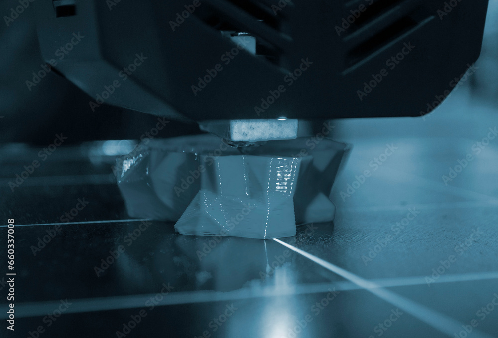 Abstract object printing on 3D printer with molten plastic close-up. 3D ...