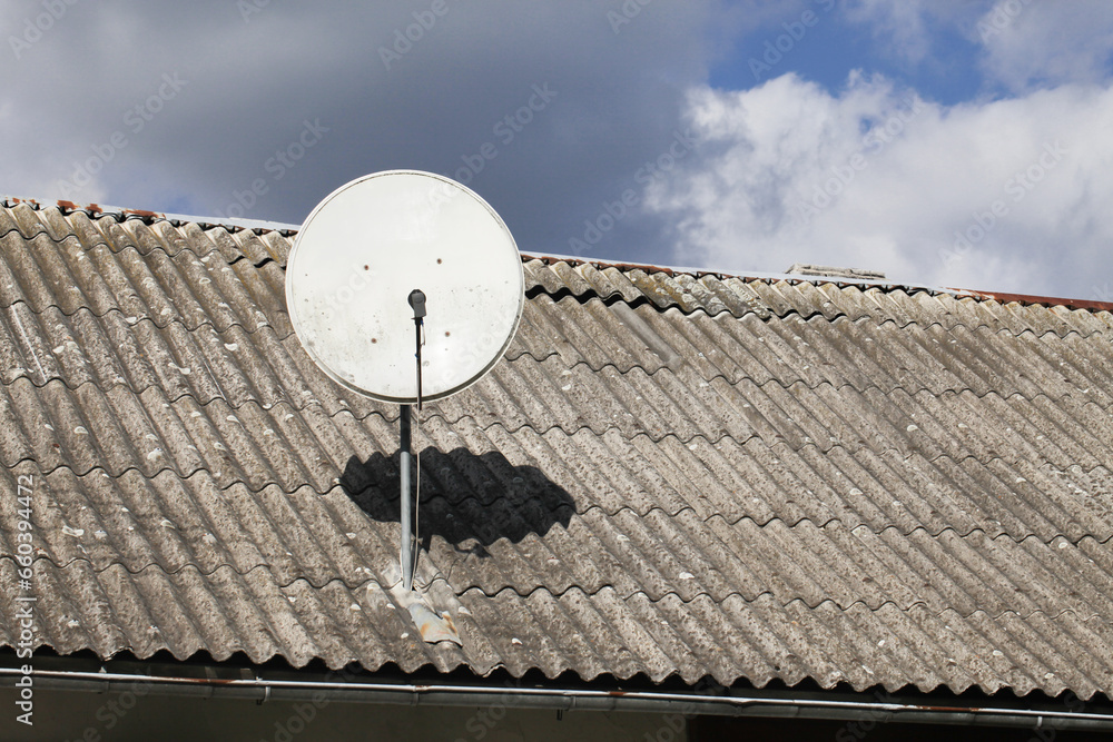 Tile roof antenna background. TV satelite dish old house roof ...