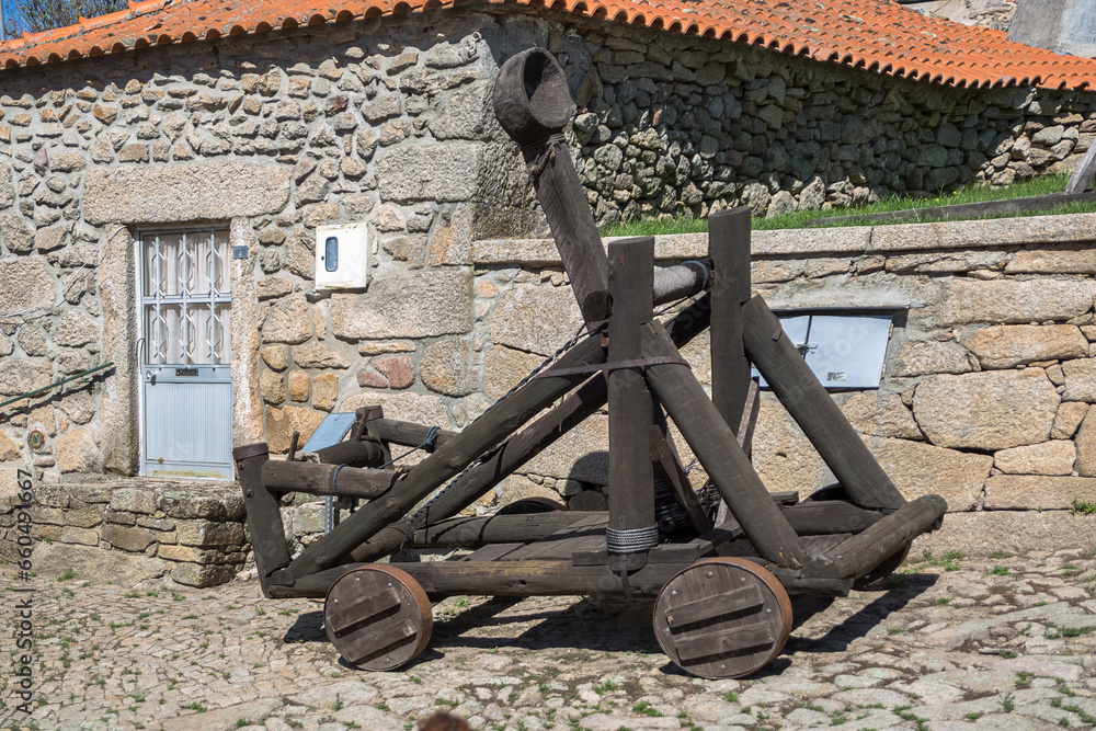 View of a medieval wooden catapult, a decorative piece in the 25 Abril ...