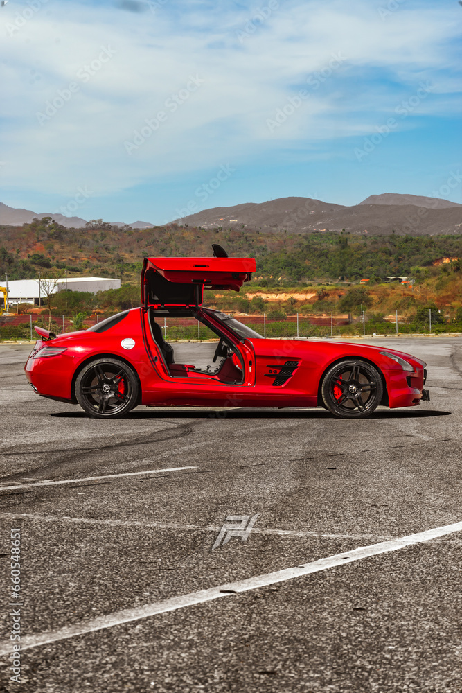 Red Mercedes Benz SLS AMG side view, gullwing doors open, Luxury ...