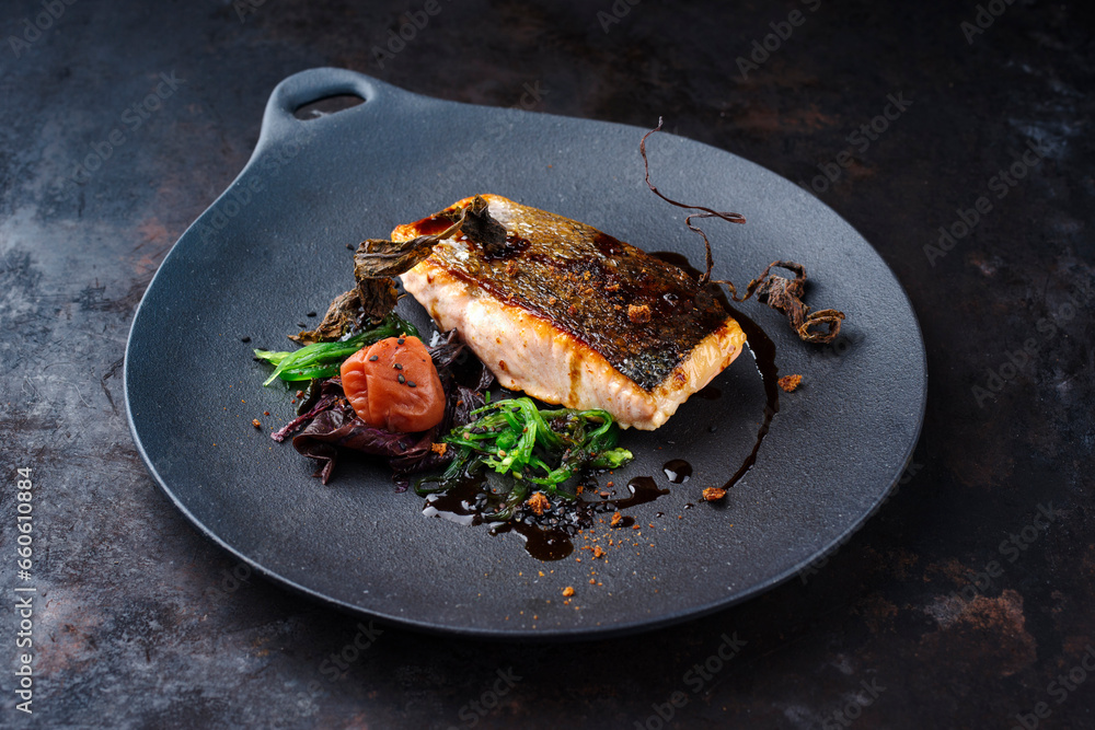 Traditional Japanese gourmet salmon fish steak tataki with algae ...