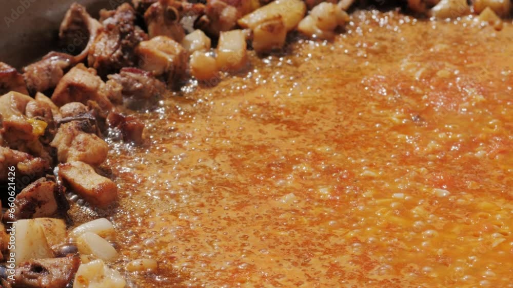 Chef Cooking traditional Spanish Paella on a stove, food festival in ...