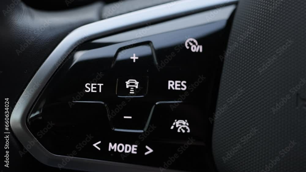 Finger press the button to start the autonomous cruise control ...