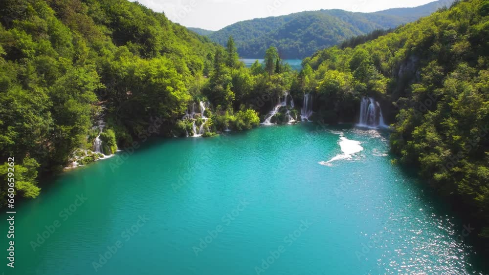 Spring water spills into rivers and waterfalls flowing into a mountain ...
