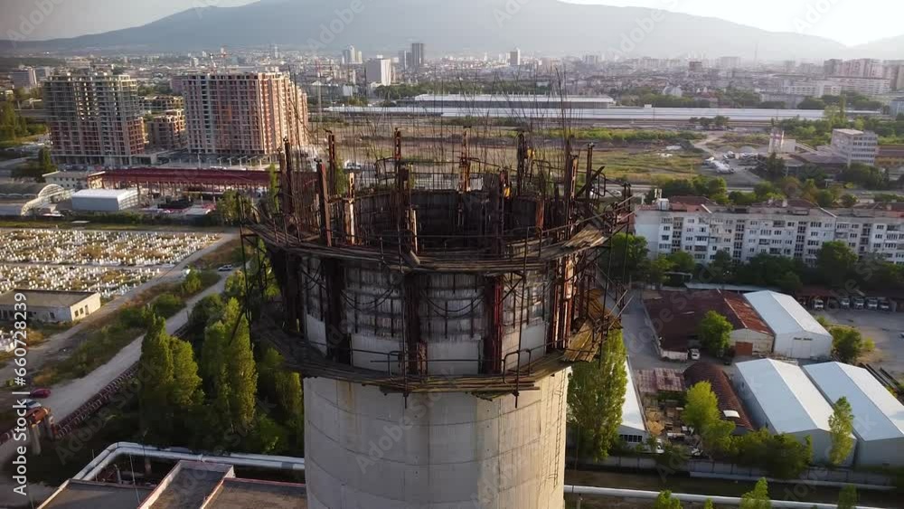 Aerial drone footage of an unfinished chimney stack. Flue-gas stack ...