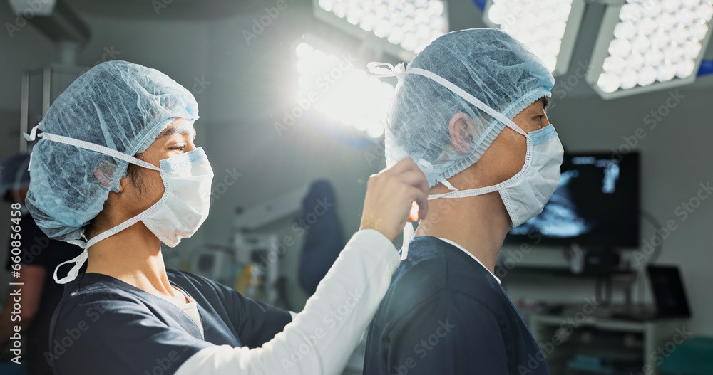 Surgery, hospital and doctors tie mask in operating room for medical ...