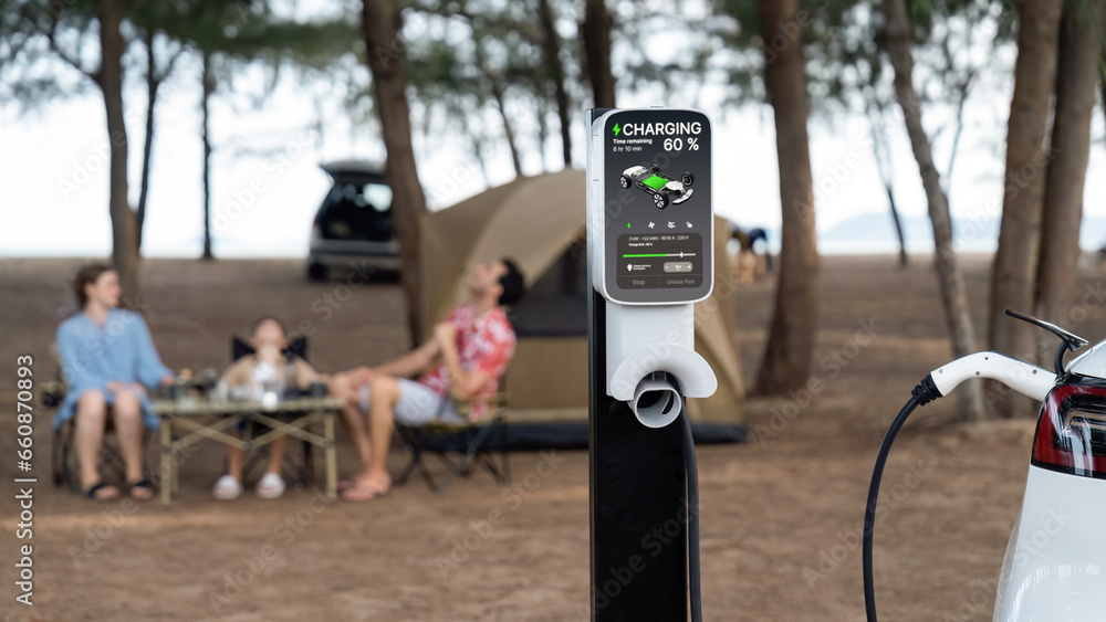 Alternative family camping trip traveling by the beach with electric ...