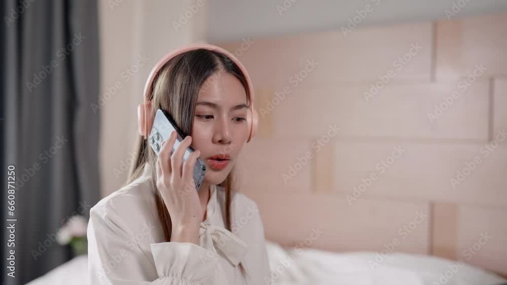 Meanwhile, a beautiful Asian woman with long hair is wearing wireless ...