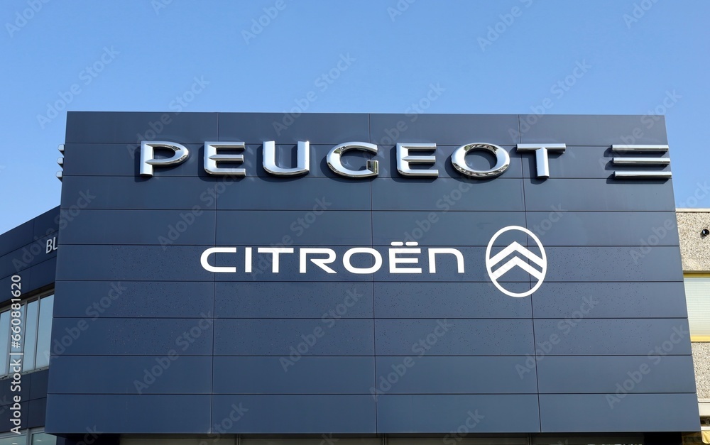 Tavagnacco, Italy. October 11, 2023. Peugeot and Citroen logos on ...