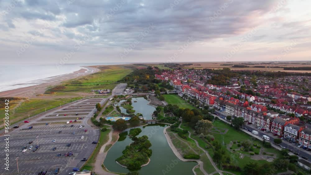 Aerial video captures the beauty of a tranquil sunset in Skegness, a ...