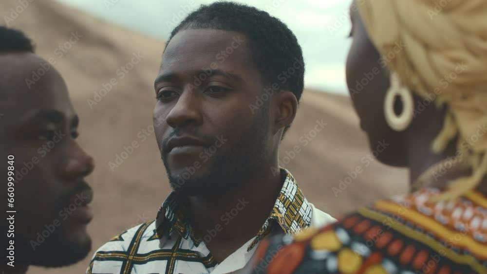 Zoom in portrait of three native African American tribe members in ...