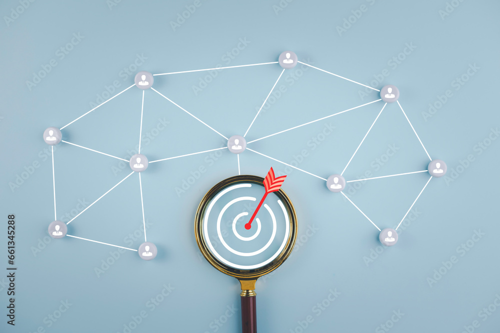 Foto de Magnifying glass focus with target objectives with business ...