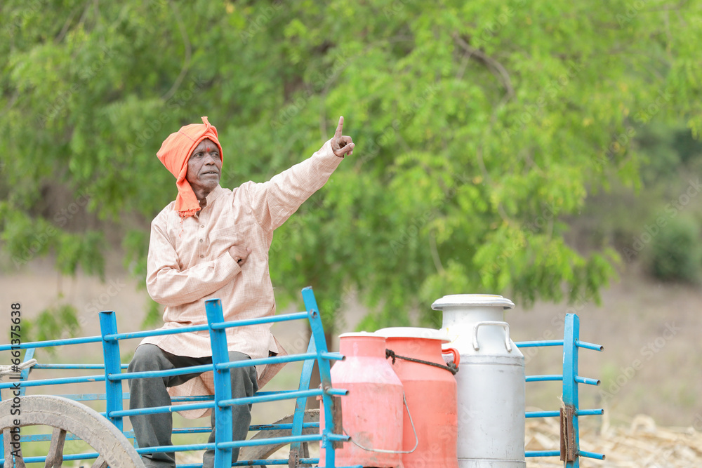happy Indian farmer selling milk Stock Photo | Adobe Stock