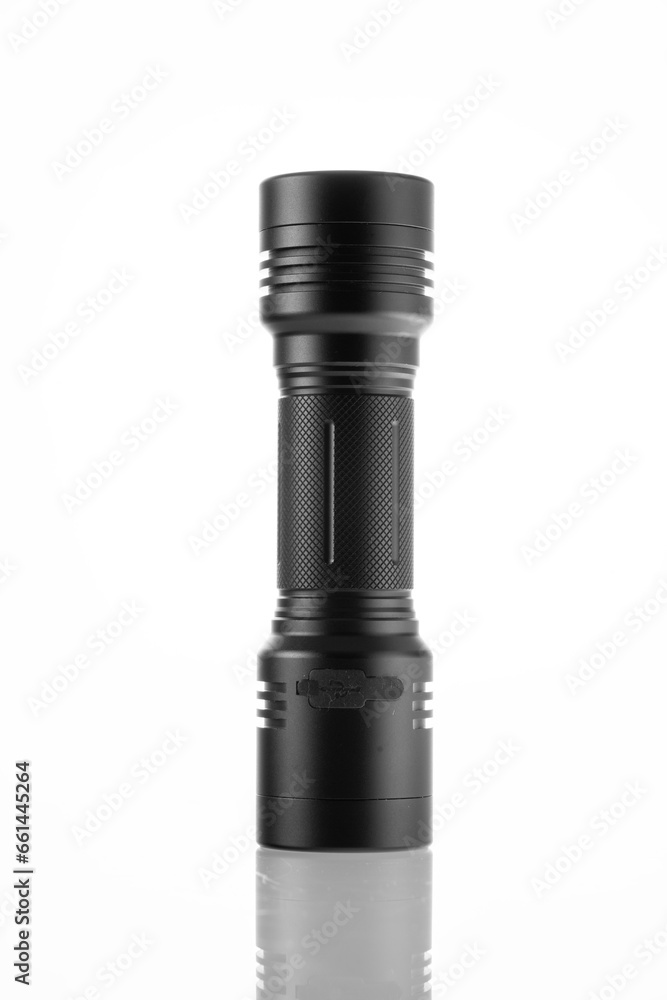 black LED modern handheld flashlight highlighted on white background ...