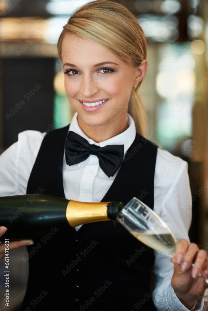 Champagne, glass and portrait of woman waitress in a elegant restaurant ...