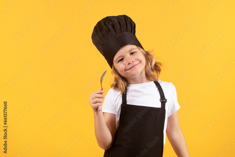 Cute kid boy cook with cooking spoon. Child chef cook prepares food on ...