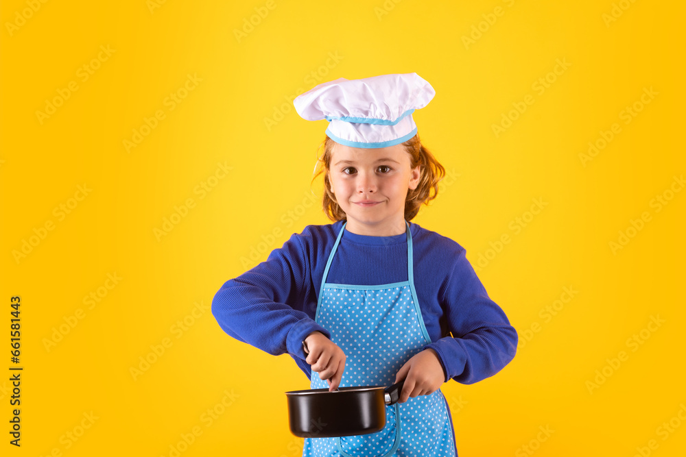 Kid chef cook with cooking pot stockpot. Chef kid boy making healthy ...