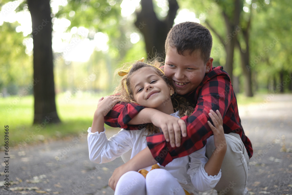 Family, hug and portrait of a girl and boy in nature. Connected and ...