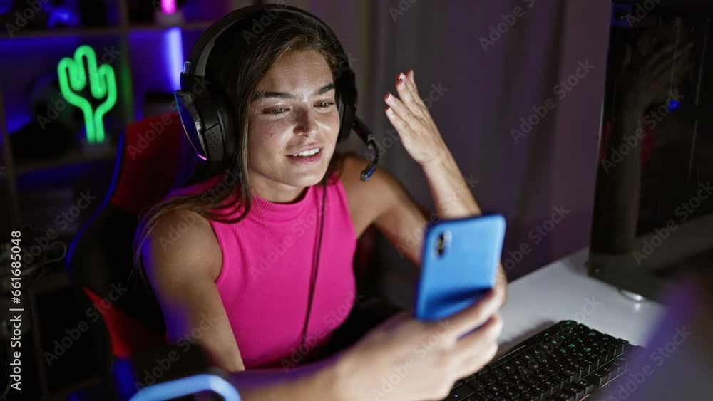Captivating glimpse of a young hispanic woman streamer smiling ...