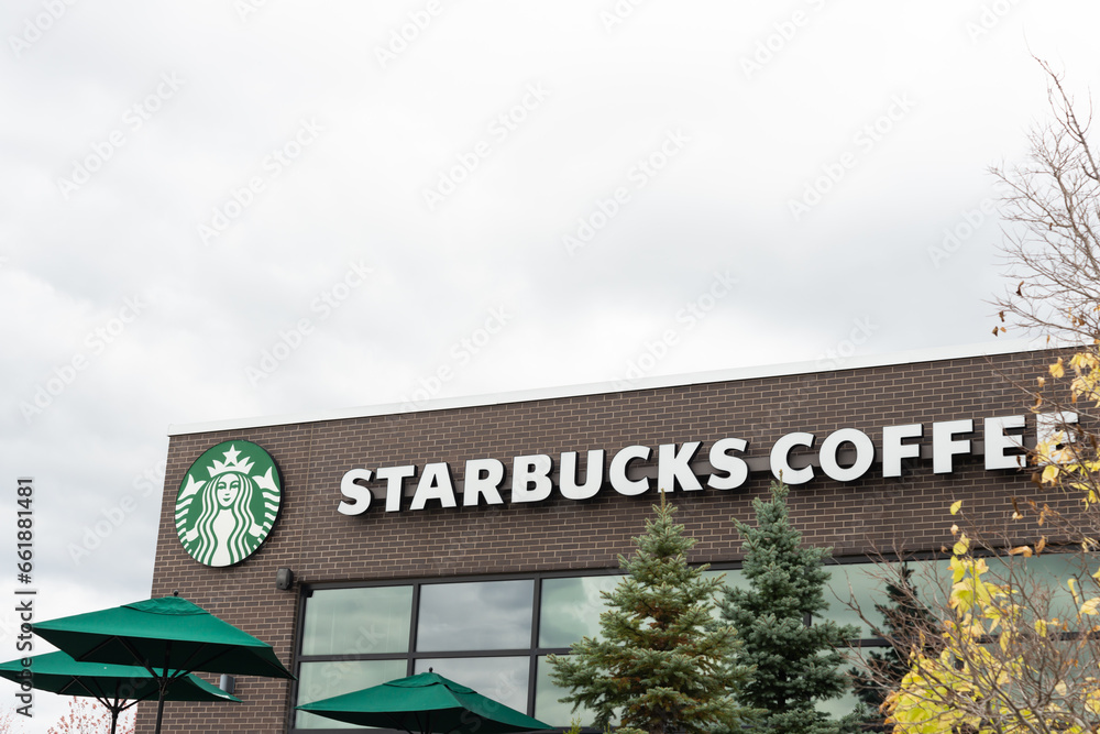 exterior building and sign of Starbucks, a coffeehouse chain, located ...