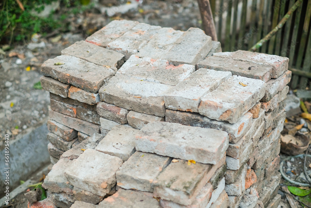 Solid clay brick used for construction, dark red brick. pile of bricks ...
