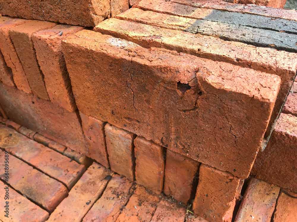 Solid clay brick used for construction, dark red brick. pile of bricks ...