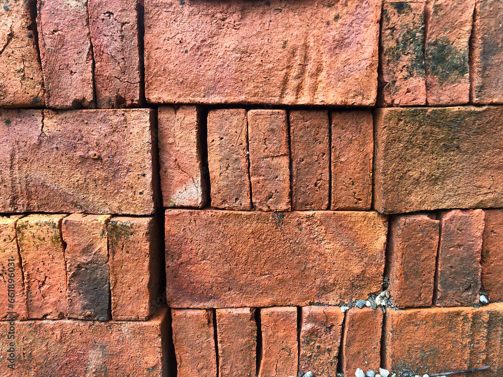 Foto de Solid clay brick used for construction, dark red brick. pile of ...