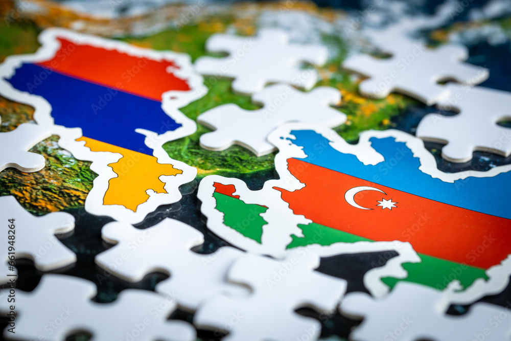 flags of Armenia and Azerbaijan among scattered puzzle pieces, on the ...