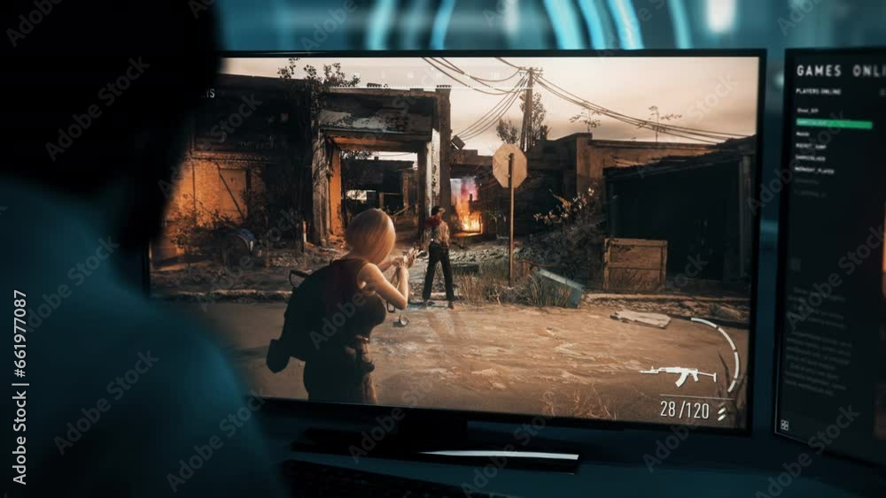 Gamer streaming the modern digital shooter game. Gamer having fun in the digital computer action ...