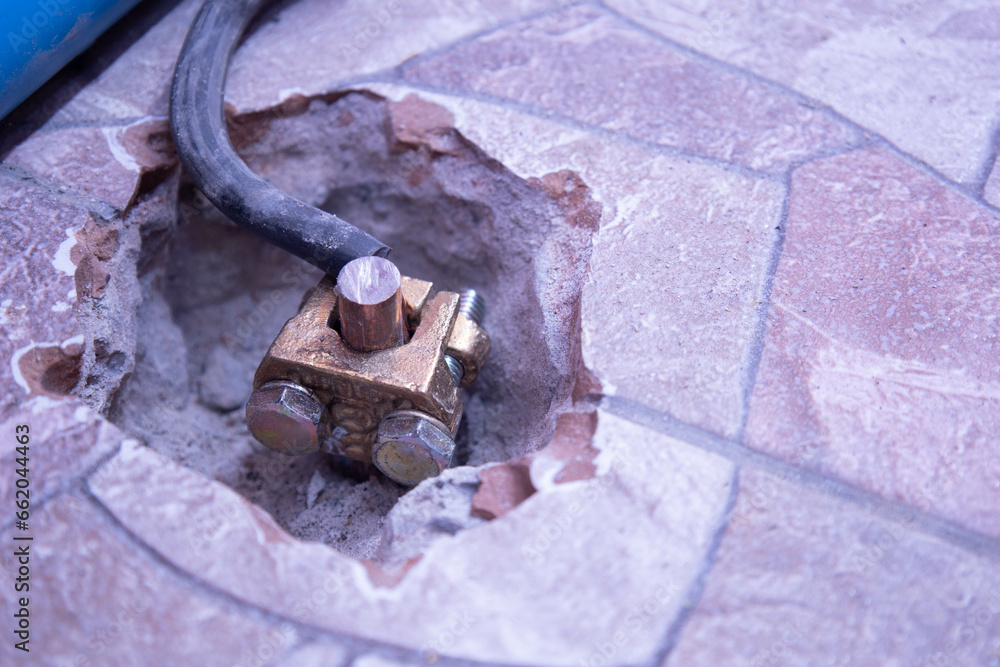 Welding ground wire on ground rod. Connecting the ground wire with a ...