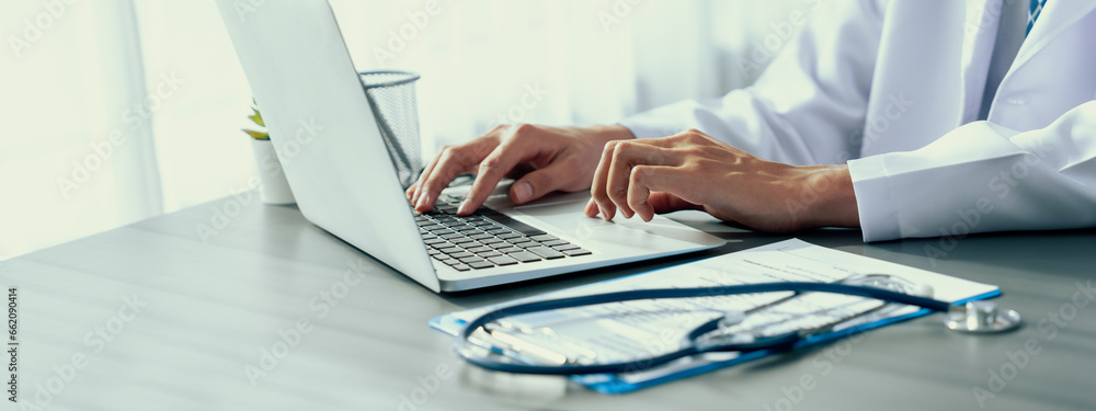 Doctor carefully review detailed medical report with laptop and ...