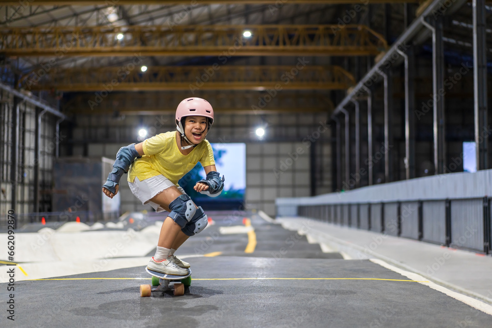 asian child skater or kid girl fun playing skateboard or smile ride ...