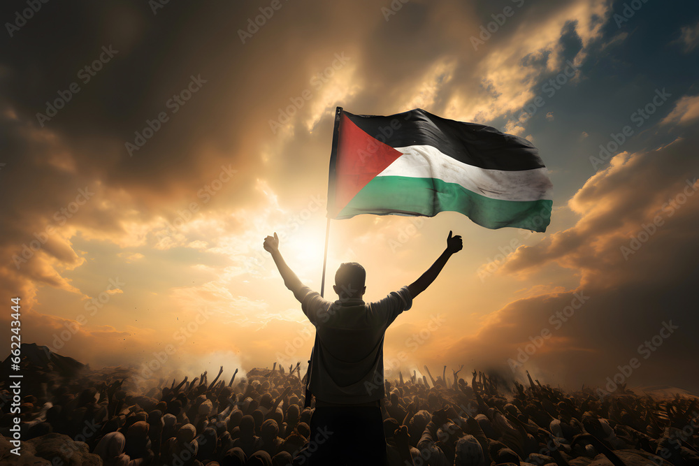 Foto de Silhouette of a Palestinian man waving Palestine flag over people. do Stock | Adobe Stock