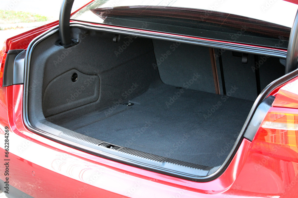 Modern red car with open empty trunk. Modern sedan car open trunk. Red ...