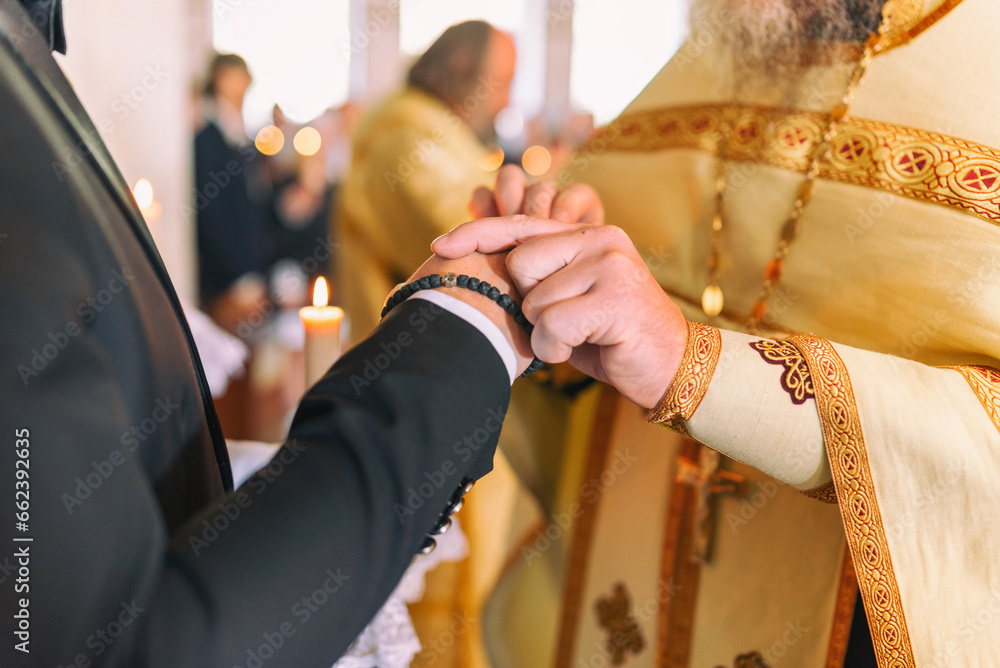 Holy wedding sacrament at the orthodox Christian church. Ring exchange ...