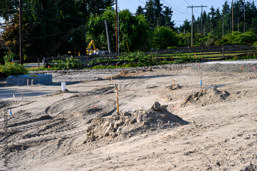 Job site preparation, site cleared and leveled, survey stakes in the ...