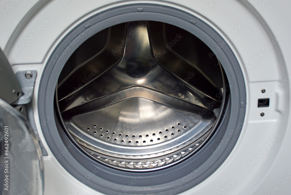 household washing machine with open loading door. close-up of a ...